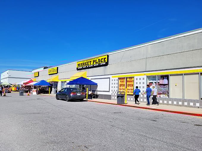 The bright yellow sign of Washington Boulevard Marketplace beckons like a treasure map X marking the spot. Bargain hunters, your quest begins here!