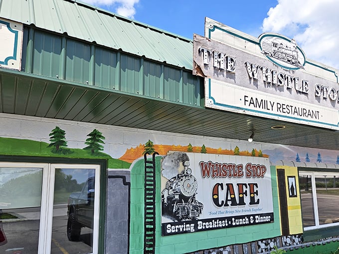 That colorful train mural tells the whole story - this is where railroad dreams meet comfort food reality.