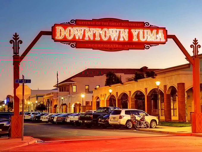 That red neon gateway welcomes you like a desert movie set come to life.