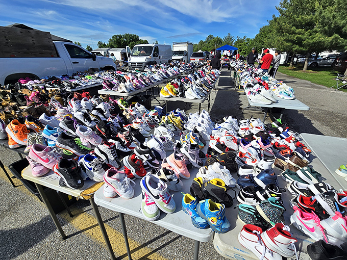Sneaker heaven spreads across tables like a rainbow of possibilities - every size, style, and color imaginable awaits.