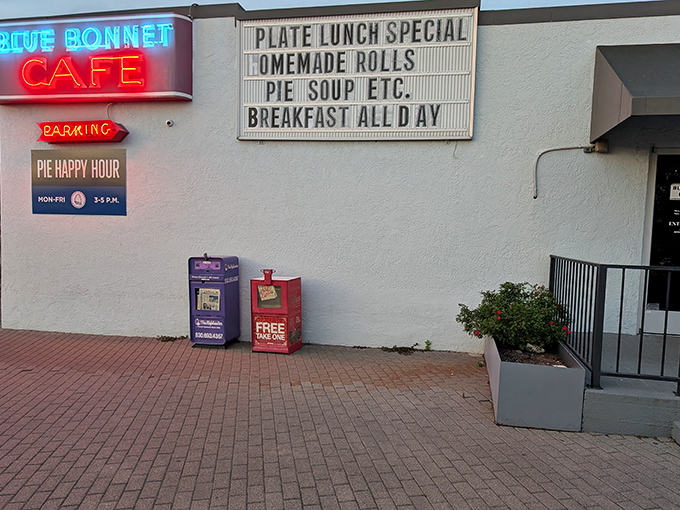 Simple white walls, honest signage - this is where real breakfast happens, no fancy frills required.