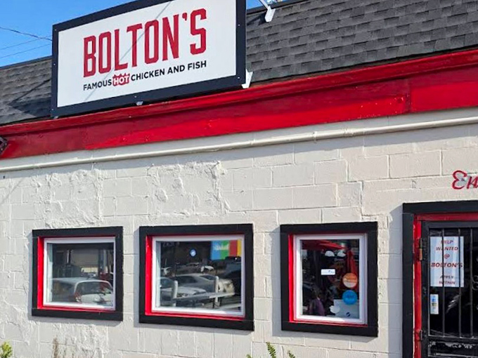 That classic red awning beckons like a spicy siren, calling all heat seekers to Nashville's chicken paradise.