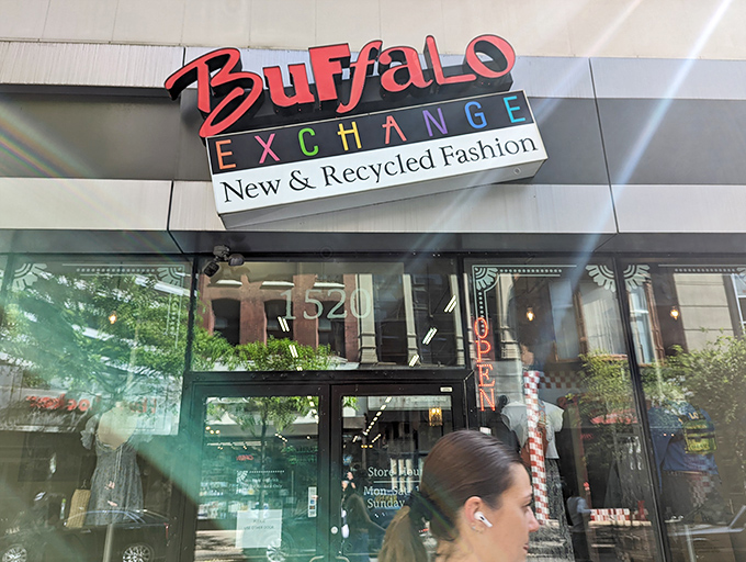 Buffalo Exchange storefront beckons with its colorful sign, promising fashion treasures behind those glass doors. Window shopping never felt so tempting!