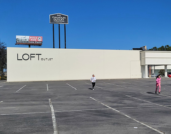 That LOFT Outlet sign stands proud as a peacock, promising designer style without the designer price tag drama.