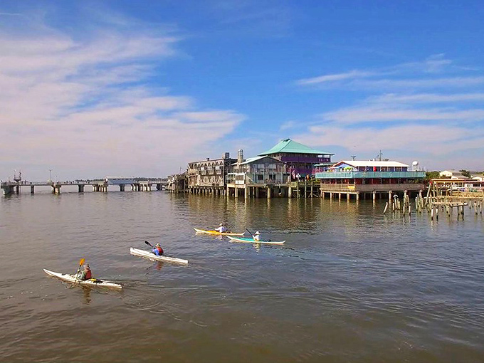 Paddle your way to paradise! These kayakers are heading toward Cedar Key's stilted treasures&mdash;like rowing into a Jimmy Buffett song come to life.