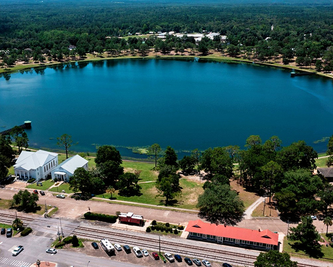 The pristine waters of DeFuniak Springs' lake reflect the town's charm&mdash;nature's mirror showing off Florida's hidden treasure.