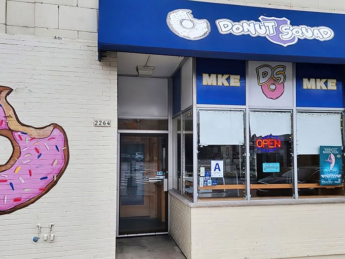 Behind that cheerful blue storefront lies a donut wonderland where creativity meets classic comfort food perfection.