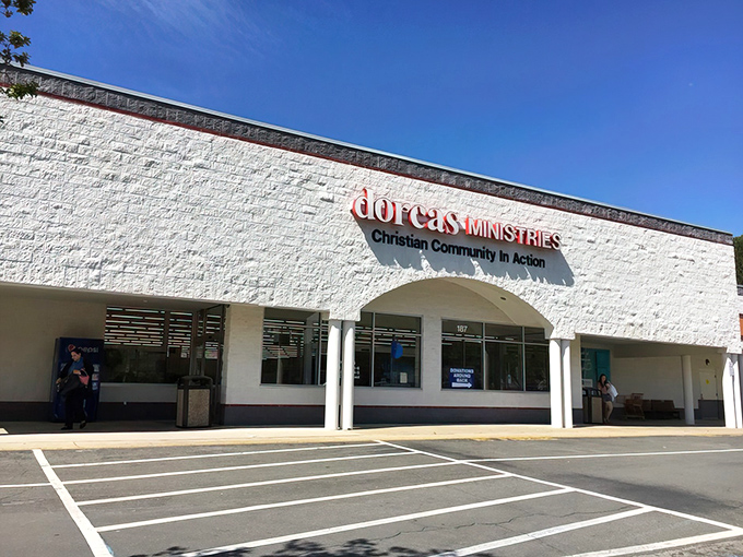 The clean white exterior promises treasures inside, where every dollar stretches like taffy at a county fair.