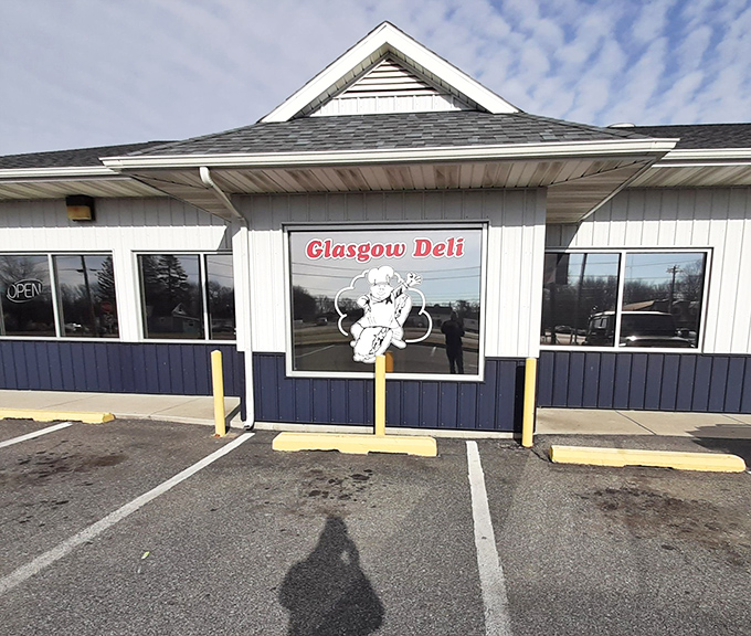 That cheerful chef on the sign isn't just whistling Dixie—he's promising sandwich magic that delivers a symphony of flavors in every bite.