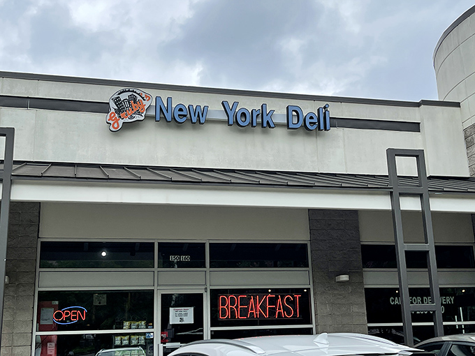 Gruby's bright blue sign beckons sandwich lovers. This Atlanta spot brings Manhattan magic to the Peach State.