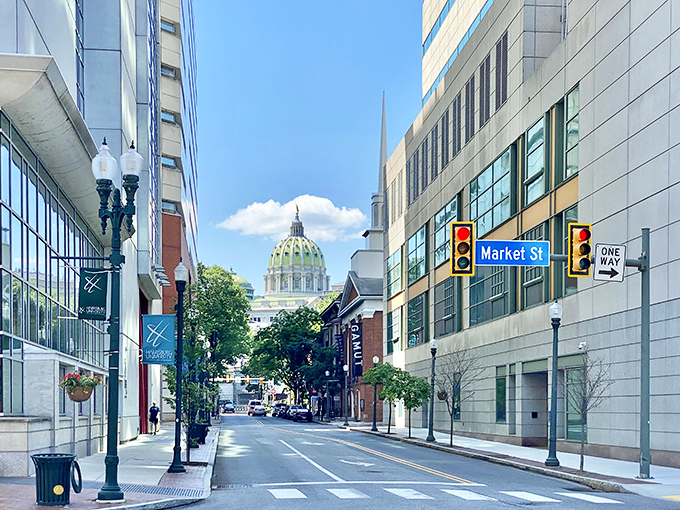 The Pennsylvania State Capitol's green dome watches over a city where affordability meets government grandeur.