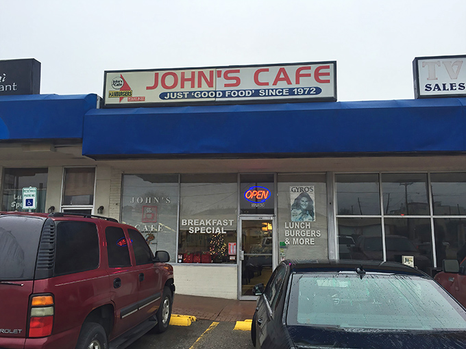 The neon "OPEN" sign at John's Cafe beckons hungry diners to a no-frills breakfast experience that locals swear by.