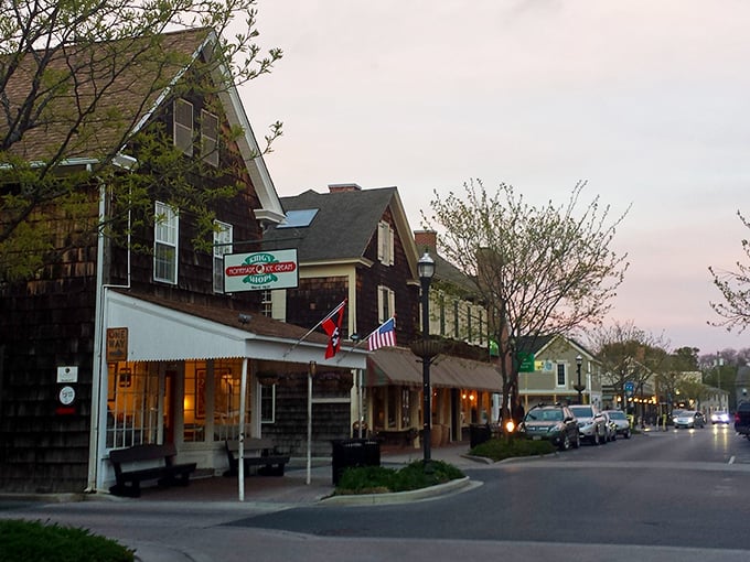 Twilight settles over Lewes' quaint shops, where American flags flutter gently and the pace of life slows to a perfect retirement rhythm.