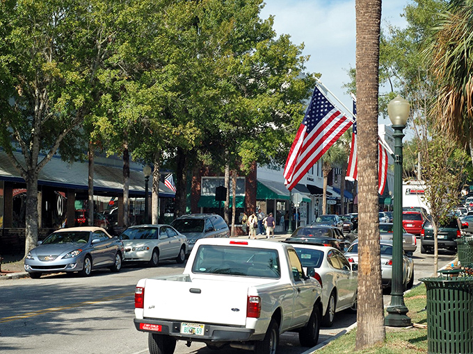 American flags flutter along Mount Dora's tree-lined streets, where small-town Florida shows its patriotic spirit.
