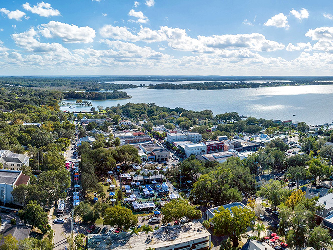 Downtown Mount Dora spreads beneath blue skies like a charming postcard, where antique shops and cafes await your discovery.