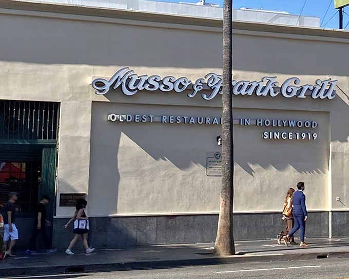 Step into old Hollywood glamour where red leather booths have witnessed countless movie deals.