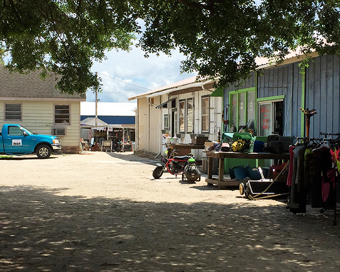 Under shady trees, vendors display their wares like a neighborhood garage sale that never ends.