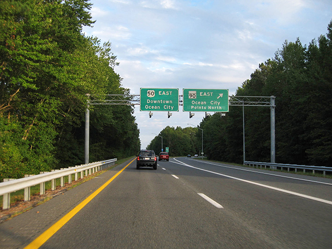The road to relaxation! These highway signs point the way to Ocean City, where retirement dreams and seafood cravings are equally satisfied.