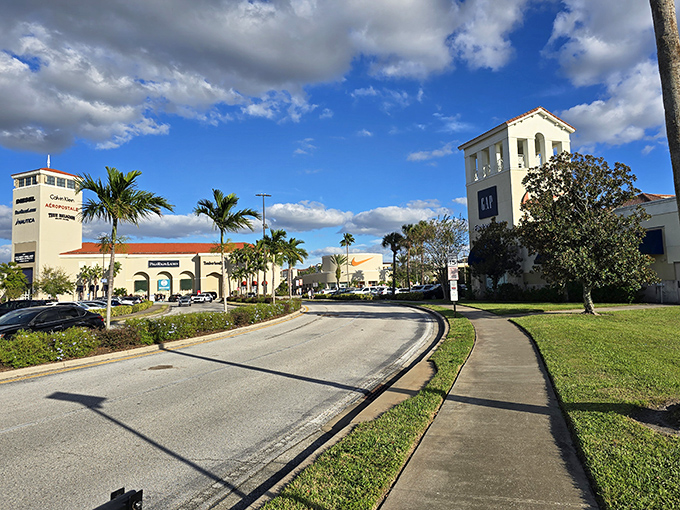 Mediterranean architecture meets shopping paradise. Palm trees and blue skies create the perfect backdrop for lightening your wallet.