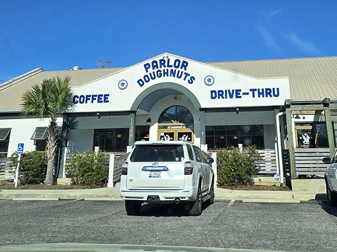 Drive-thru donut dreams! Parlor's palm-lined paradise lets you grab layered delights without leaving your car's comfort.