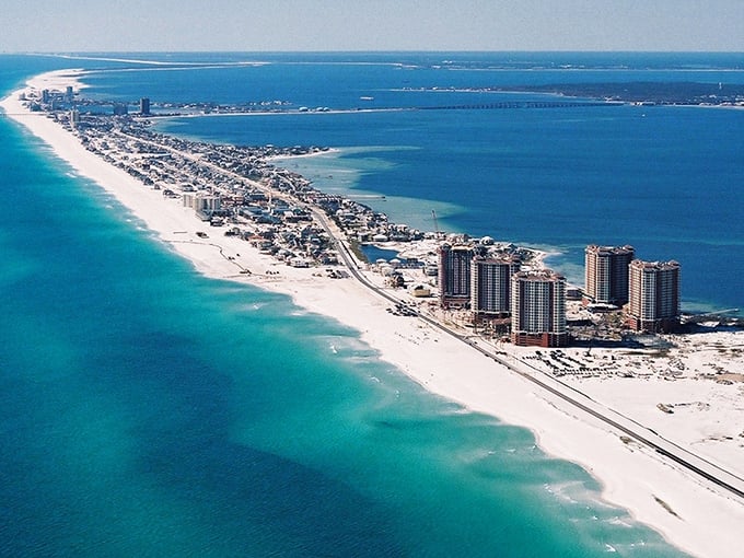 From above, Pensacola's coastline unfolds like nature's own masterpiece painted in turquoise and white.