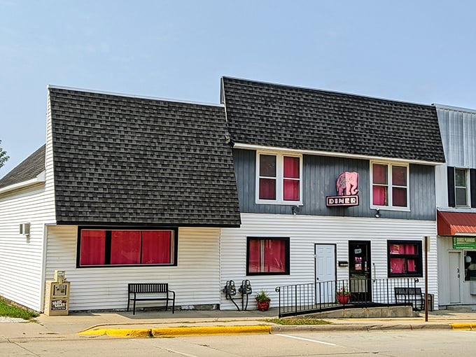 This charming two-story diner with its pink sign might look unassuming, but inside awaits breakfast magic worth waking up for.
