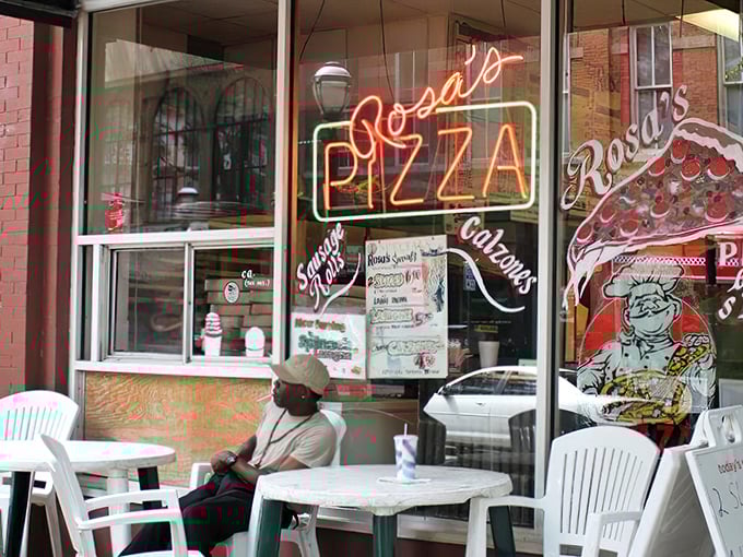 When windows tell pizza stories this vividly, you know the slices inside deliver on every colorful promise.