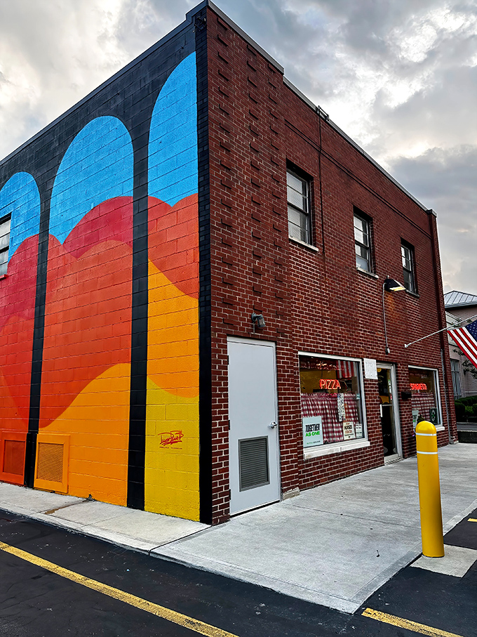 That colorful mural transforms an ordinary building into a pizza lover's beacon of hope and happiness.