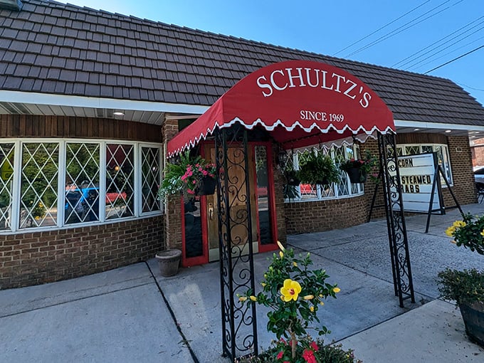 Classic brick and diamond windows frame decades of crab-cracking memories at this Essex neighborhood treasure.