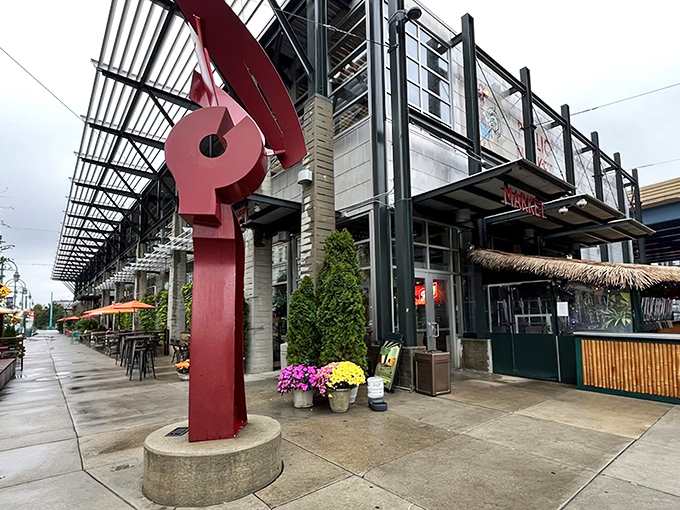 The iconic red sculpture stands guard over Milwaukee's culinary playground, where seafood dreams come deliciously true.