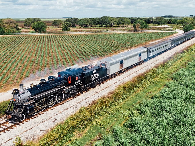 Rolling through endless sugarcane fields, this vintage beauty proves Florida's countryside holds unexpected railroad treasures.