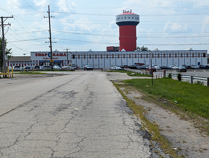That iconic water tower stands like a lighthouse, guiding bargain hunters to shores of unexpected treasures.