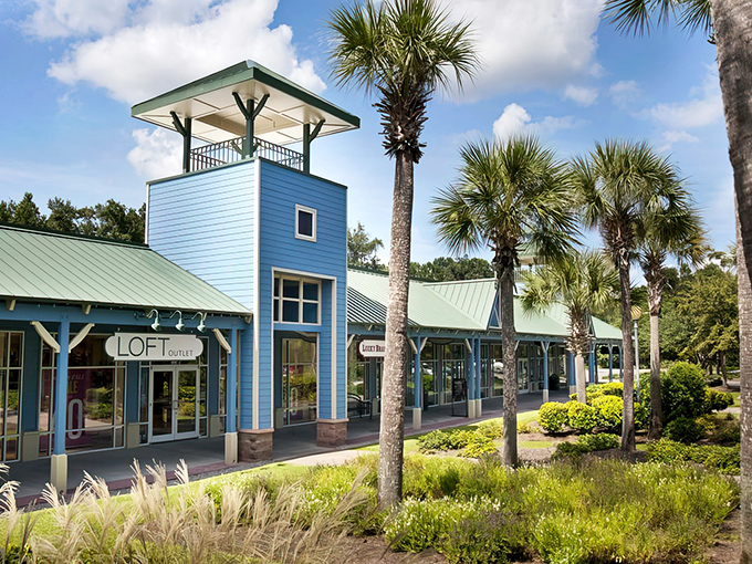 Palm trees and coastal blue storefronts create that "I'm-on-vacation-but-also-scoring-deals" vibe that makes shopping here doubly satisfying.