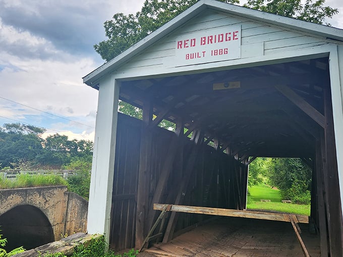 The iconic Red Bridge welcomes visitors with its classic and pristine white trim—a perfect introduction to Pennsylvania's rich covered bridge heritage.