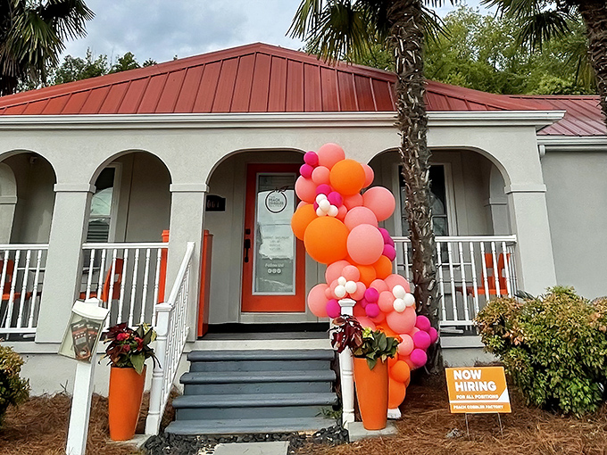 A splash of orange and pink balloons adds festive charm to this cozy dessert haven. Peach paradise awaits!