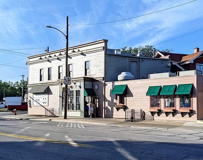 Those green awnings have sheltered countless conversations and legendary hot dogs through decades of Toledo history.