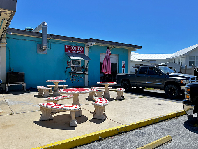 Picnic tables with pizza-themed tops? Now that's what I call dining with personality and Florida flair.