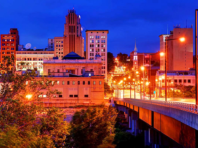 Evening lights dance across Youngstown's skyline, creating magic from industrial bones and community spirit.