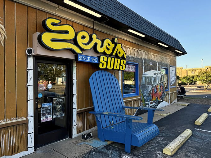 The blue Adirondack chair outside Zero's says "relax" while the tiki-style roof whispers "vacation mode activated."