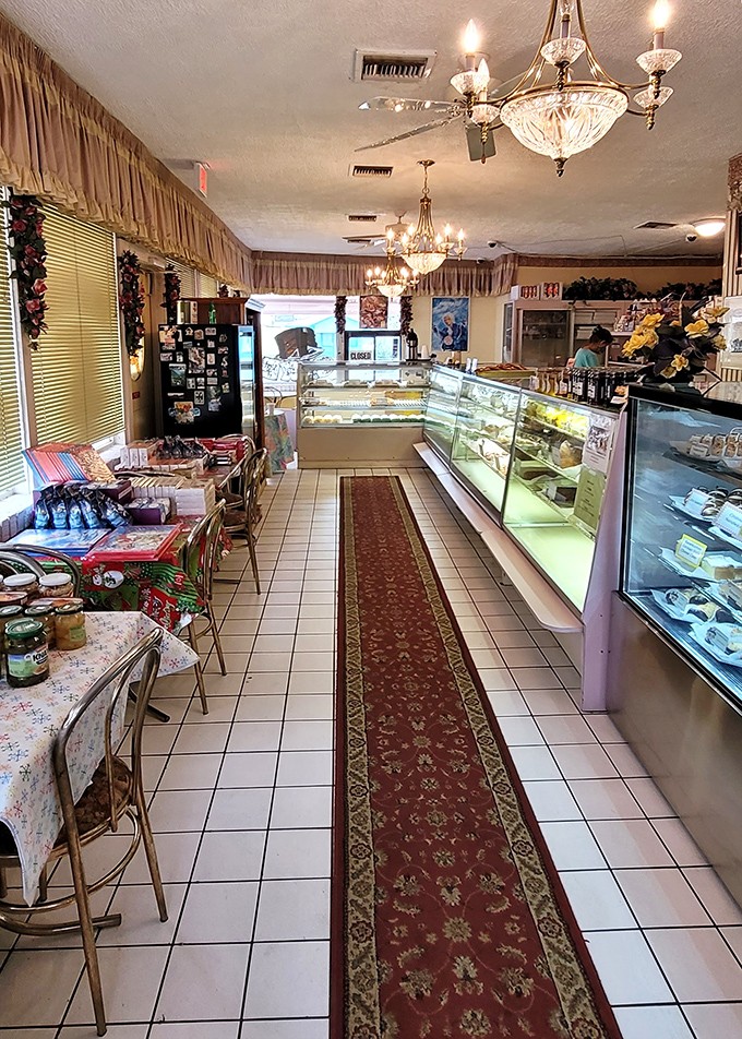 Crystal chandeliers hanging over display cases full of pastries? It's like Bavarian royalty decided to vacation in St. Petersburg and brought their best bakers along.