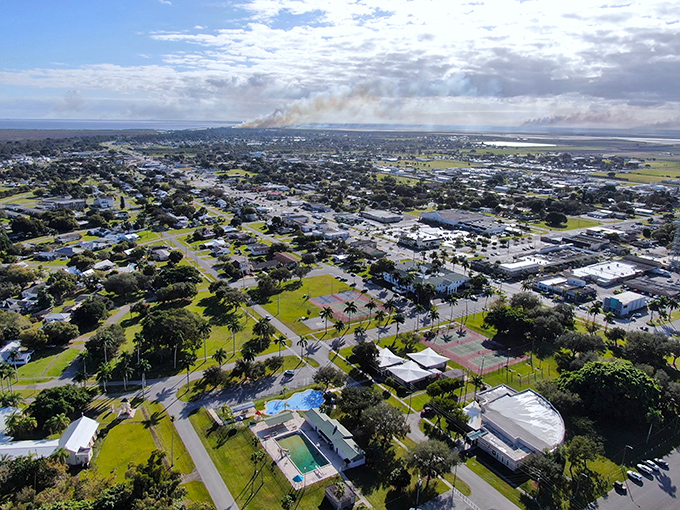 From above, Clewiston unfolds like a patchwork quilt of green spaces and modest homes, proving paradise doesn't need high-rises to deliver the Florida dream. 