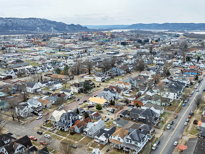 From above, Portsmouth reveals itself as a patchwork of neighborhoods nestled between rolling hills and the Ohio River, with the iconic bridge connecting it to Kentucky.