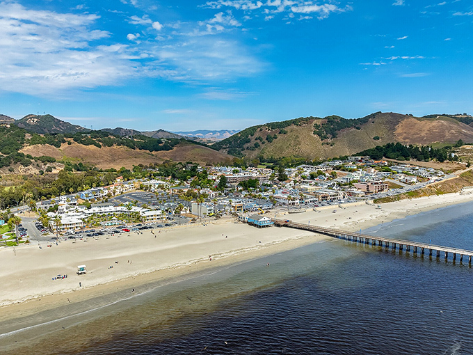 From above, Avila Beach reveals its perfect horseshoe bay, nestled between protective hills that seem to cradle this coastal gem like precious cargo.