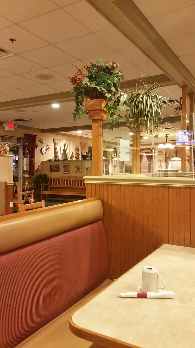 Wooden booths and hanging plants create that perfect "somebody's-taking-care-of-you" vibe that makes comfort food taste even better.