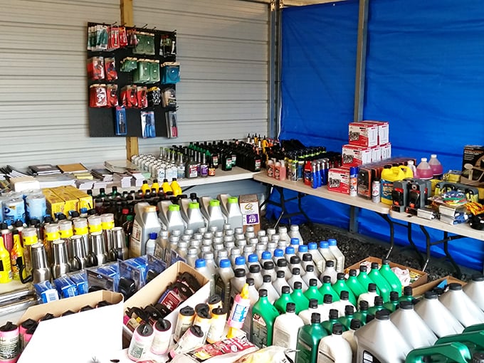 Automotive aficionados rejoice! This vendor's meticulously organized display of fluids and supplies would make even the most disorganized garage feel jealous. 