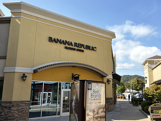 Banana Republic Factory Store beckons with mountain views in the background – fashion meets Blue Ridge beauty.