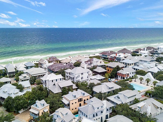 From above, Rosemary Beach reveals its perfect harmony&mdash;pristine white homes nestled between emerald waters and lush greenery. Beach real estate poetry.
