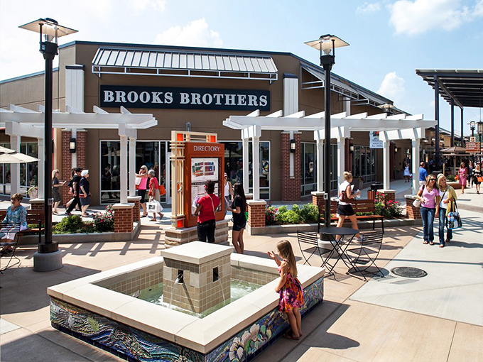 Brooks Brothers anchors the premium experience with classic American style. That little fountain isn't just pretty&mdash;it's where shopping companions recharge their patience.