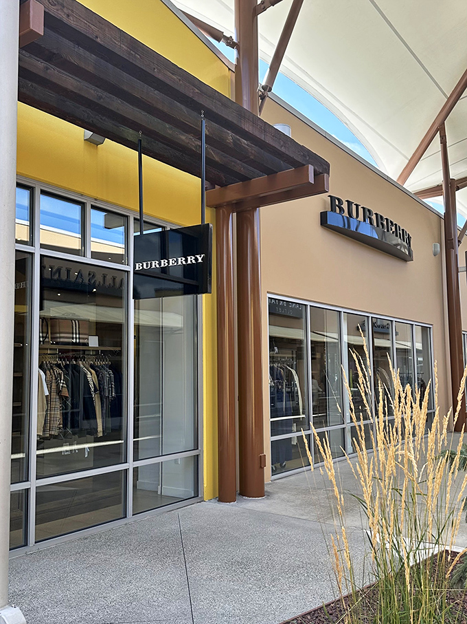 Burberry's iconic patterns beckon from behind glass, promising that classic British style without the need for a royal inheritance. 