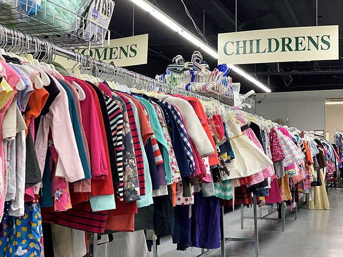 A rainbow of possibilities in the children's section. Each tiny garment represents both savings for parents and the joy of discovering that perfect outfit for growing kids.